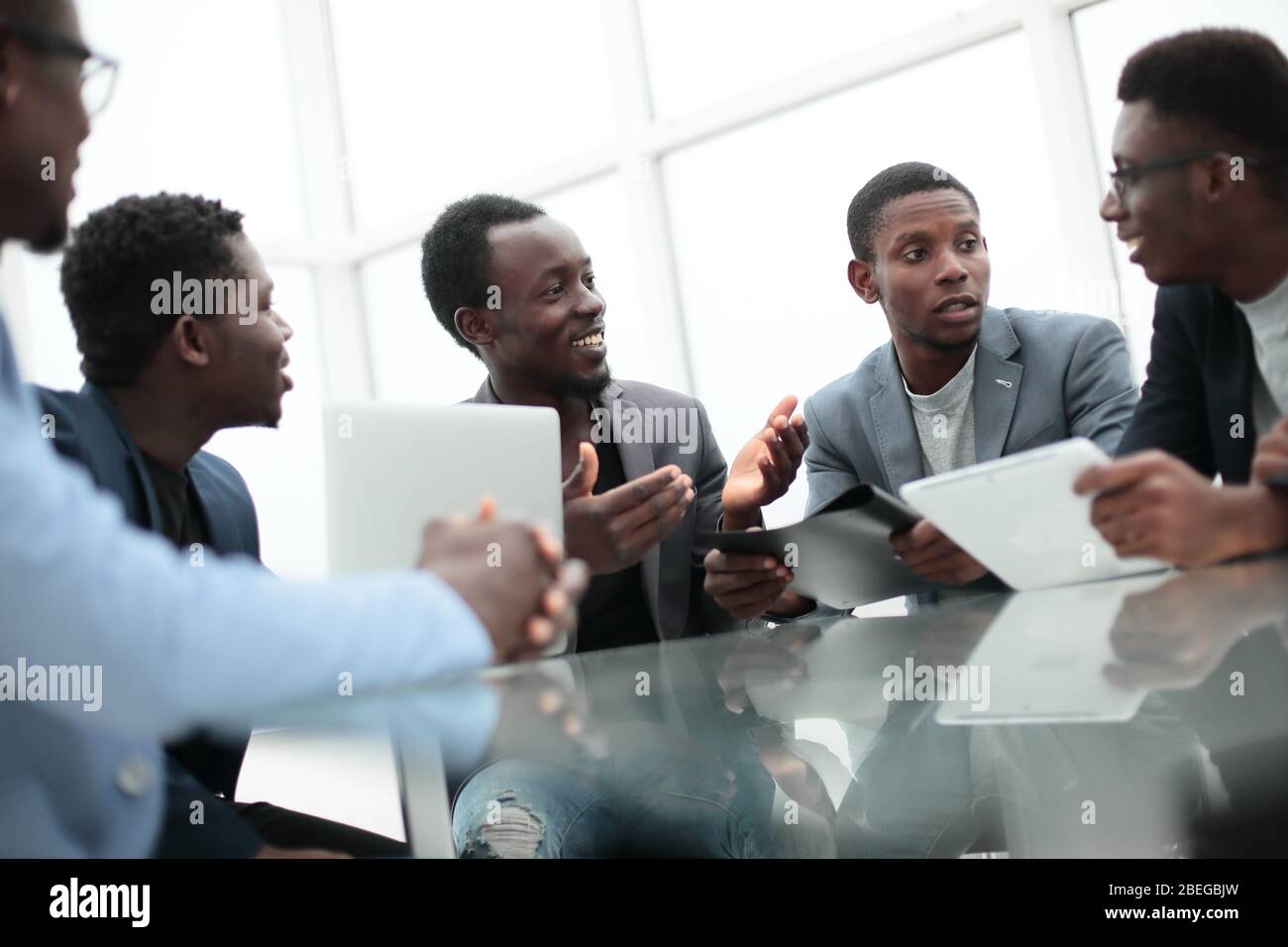 group of smiling employees giving a thumbs up Stock Photo - Alamy