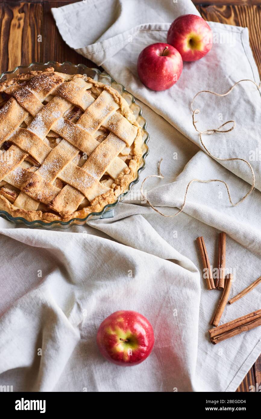 Homemade apple pie on the brown wooden table. Apple tart with lattice ...