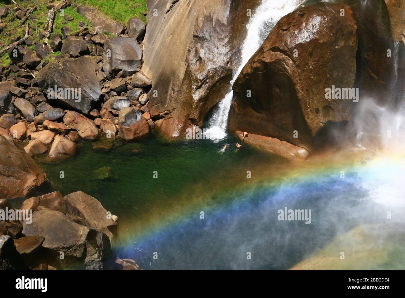 Sunny view of the Vernal Fall with a rainbow below at Yosemite National ...