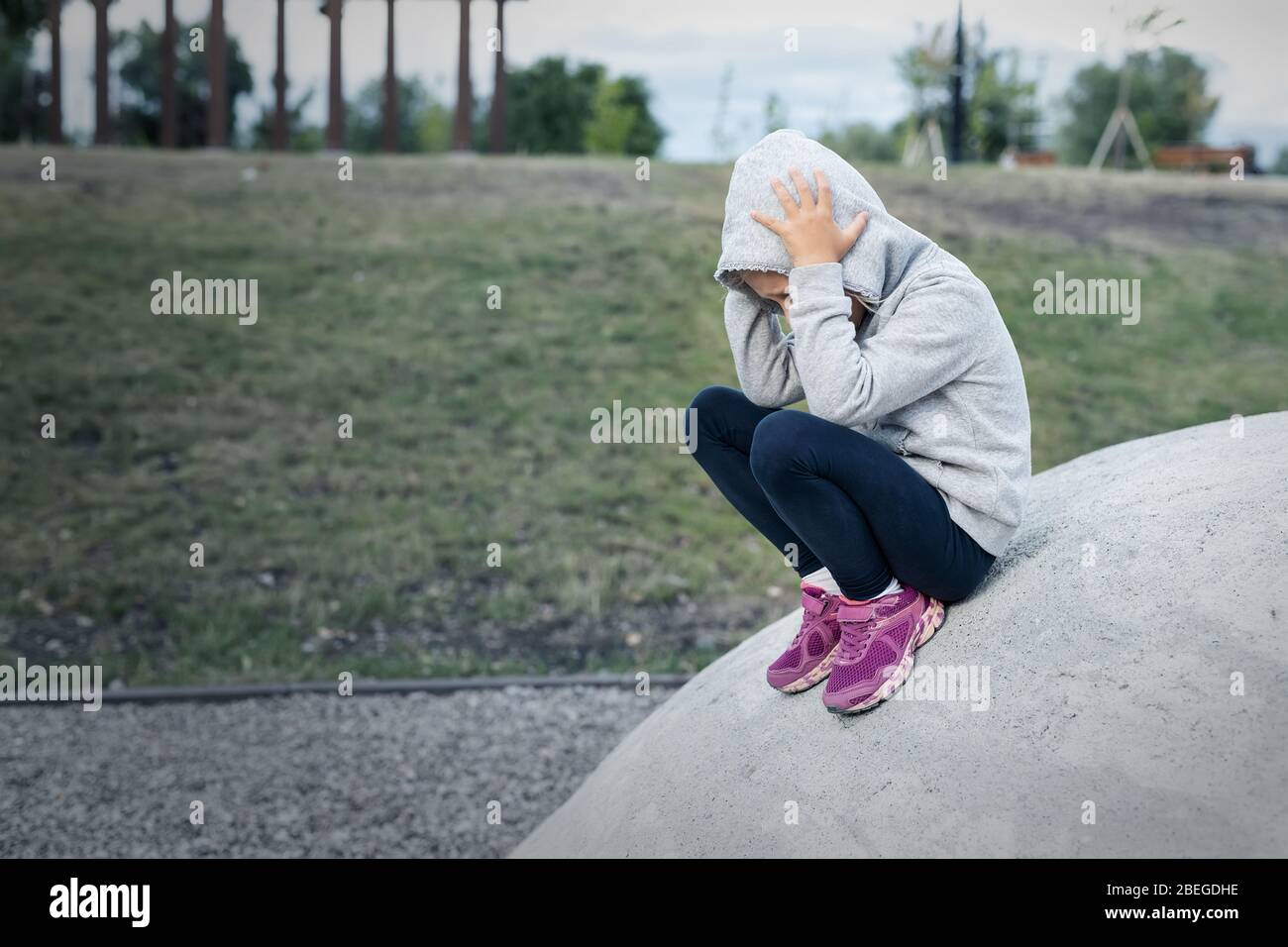 Sad Girl Sitting Alone Outside High Resolution Stock Photography and ...