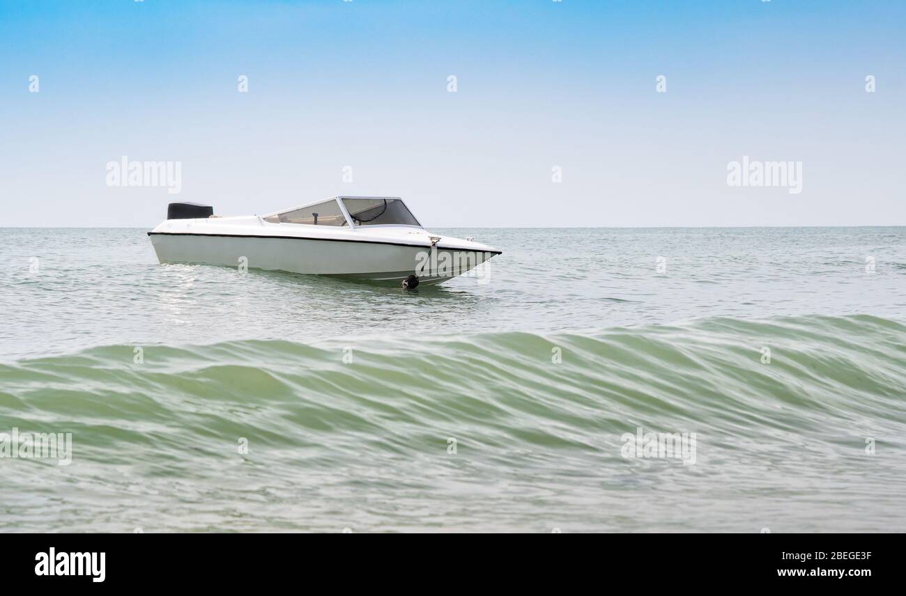 Traditional white boat with anchor at bay. Travel destination concept ...