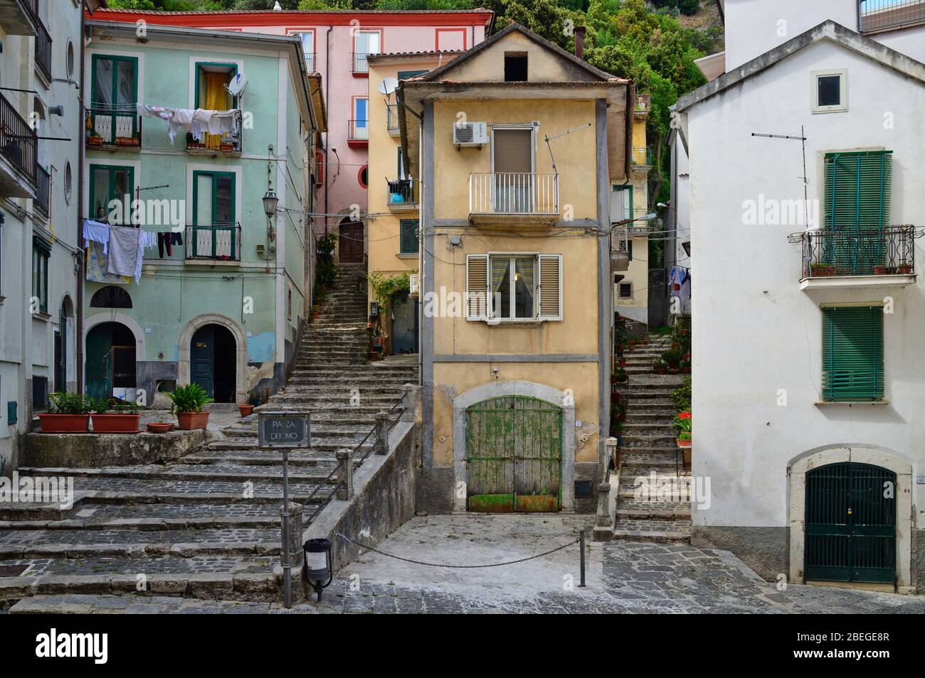 A narrow street between the old houses of Campagna, a town in the ...