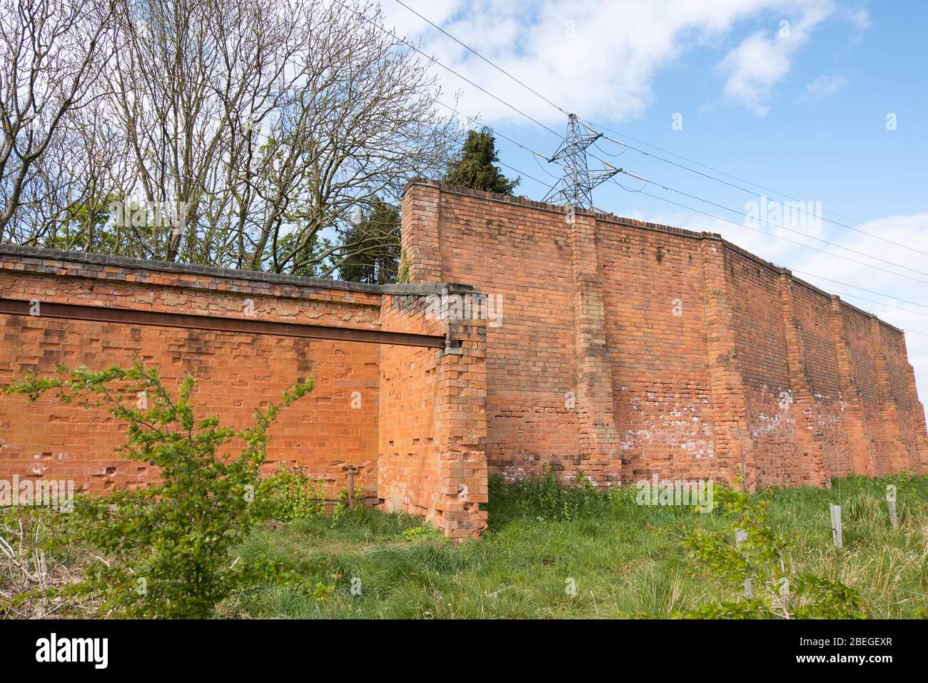 Tall brick wall of an old rifle range Stock Photo - Alamy