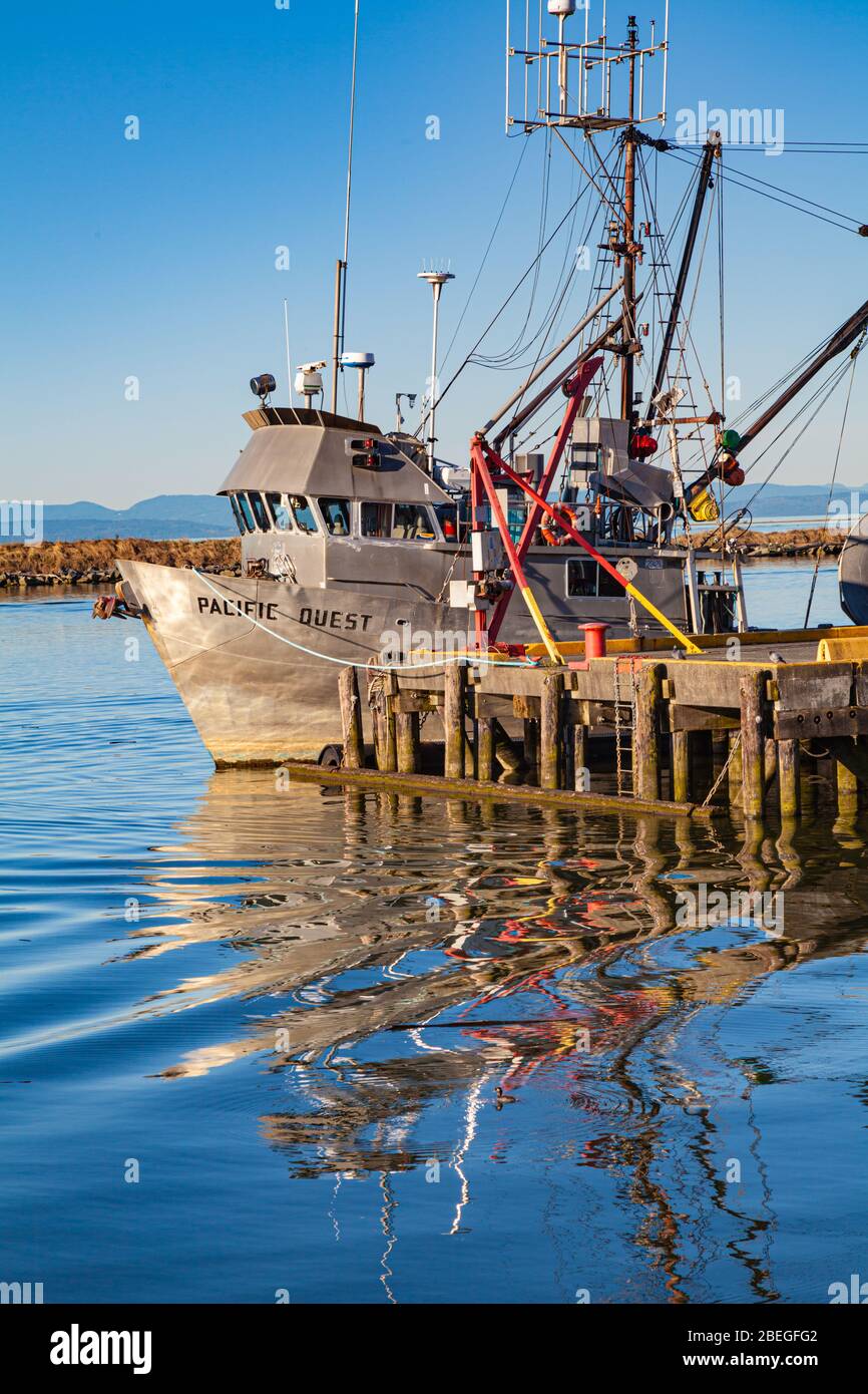Commercial fishing vessel with reflection in Steveston British Columbia ...