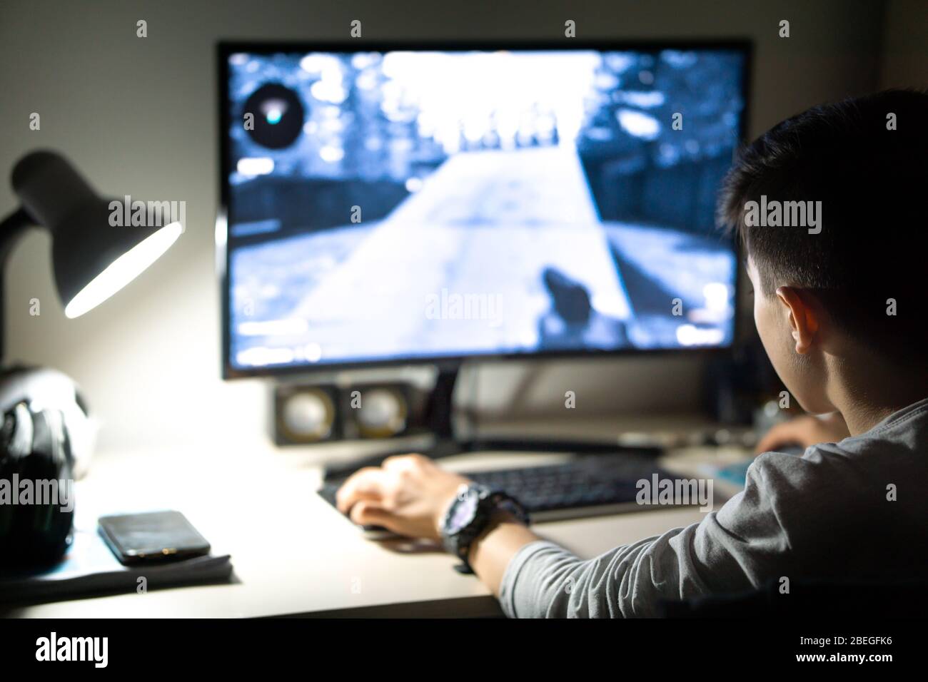 Teen playing video game computer hi-res stock photography and images ...
