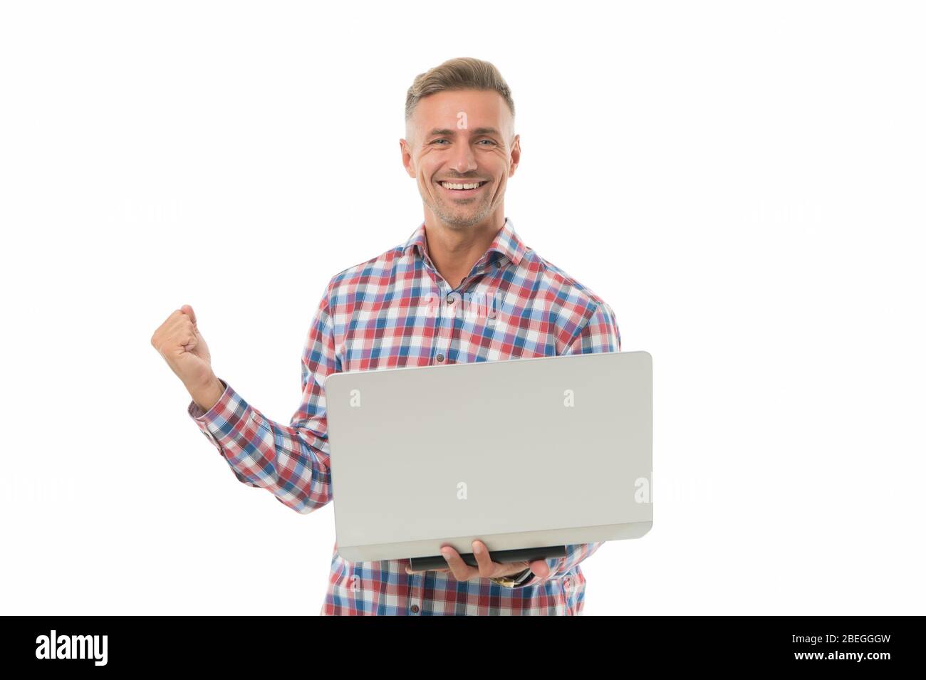 Bingo. Happy winner hold laptop isolated on white. Handsome man make ...