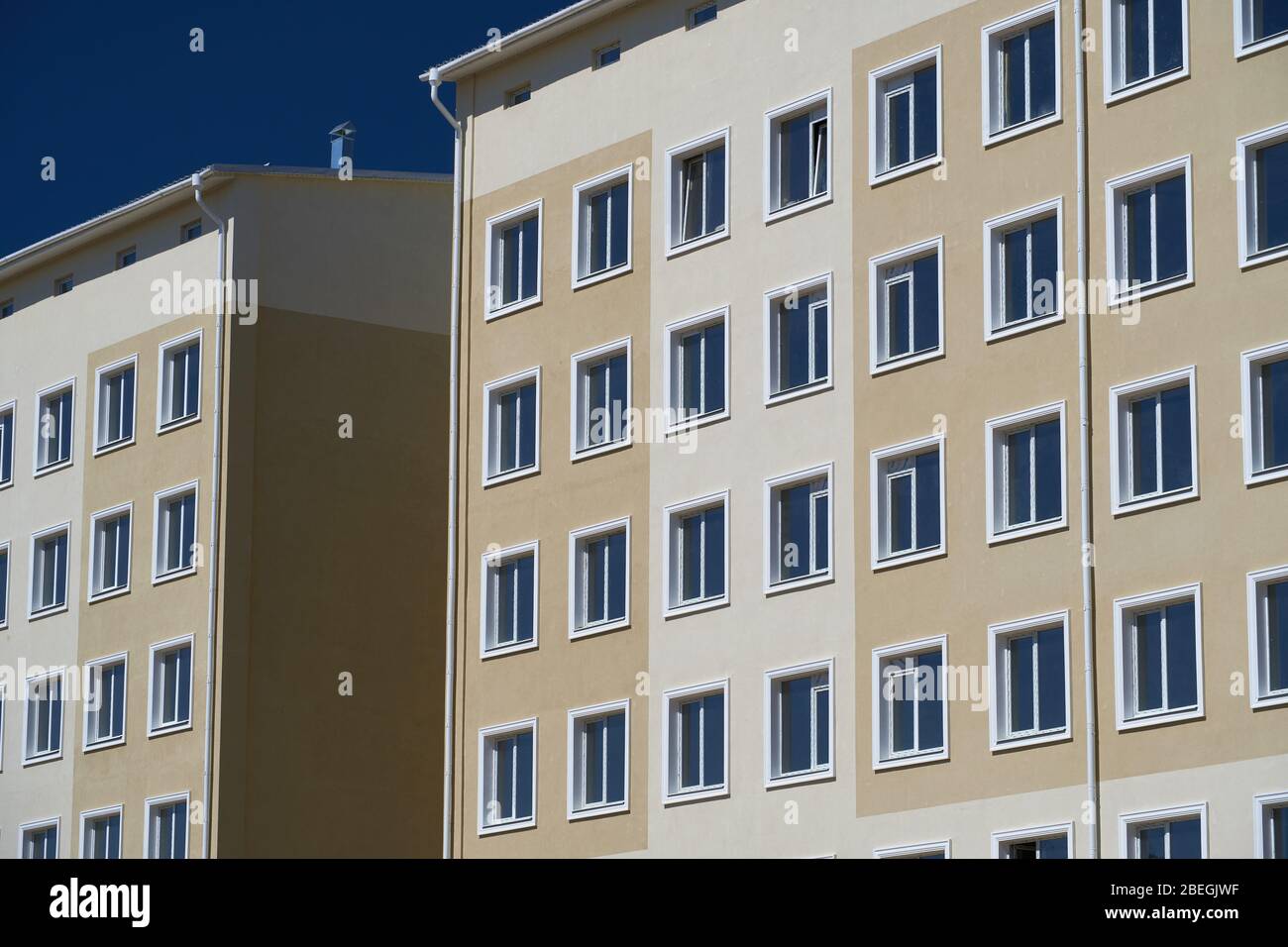 facade of a new multi-storey building with many windows Stock Photo - Alamy