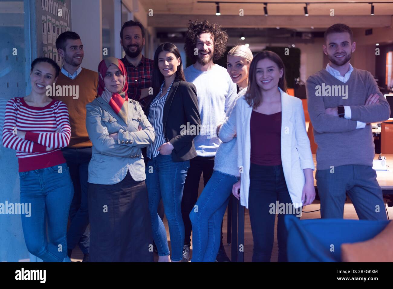 Portrait of pretty successful multi-ethnic corporate close-knit team ...