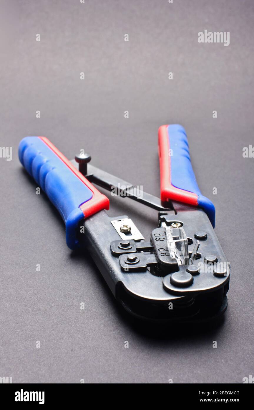 Network cable crimping tool isolated on the white background Stock ...