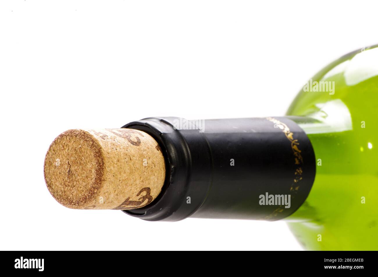 Wine cork in the wine bottle close up isolated on the white background ...
