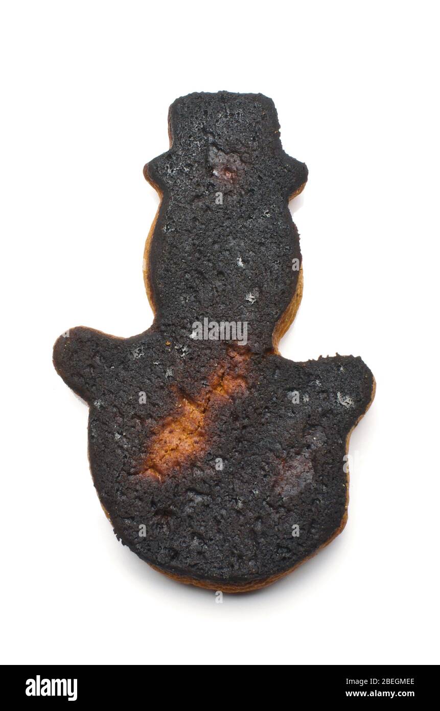 Burnt black gingerbread biscuit isolated on the white background Stock ...