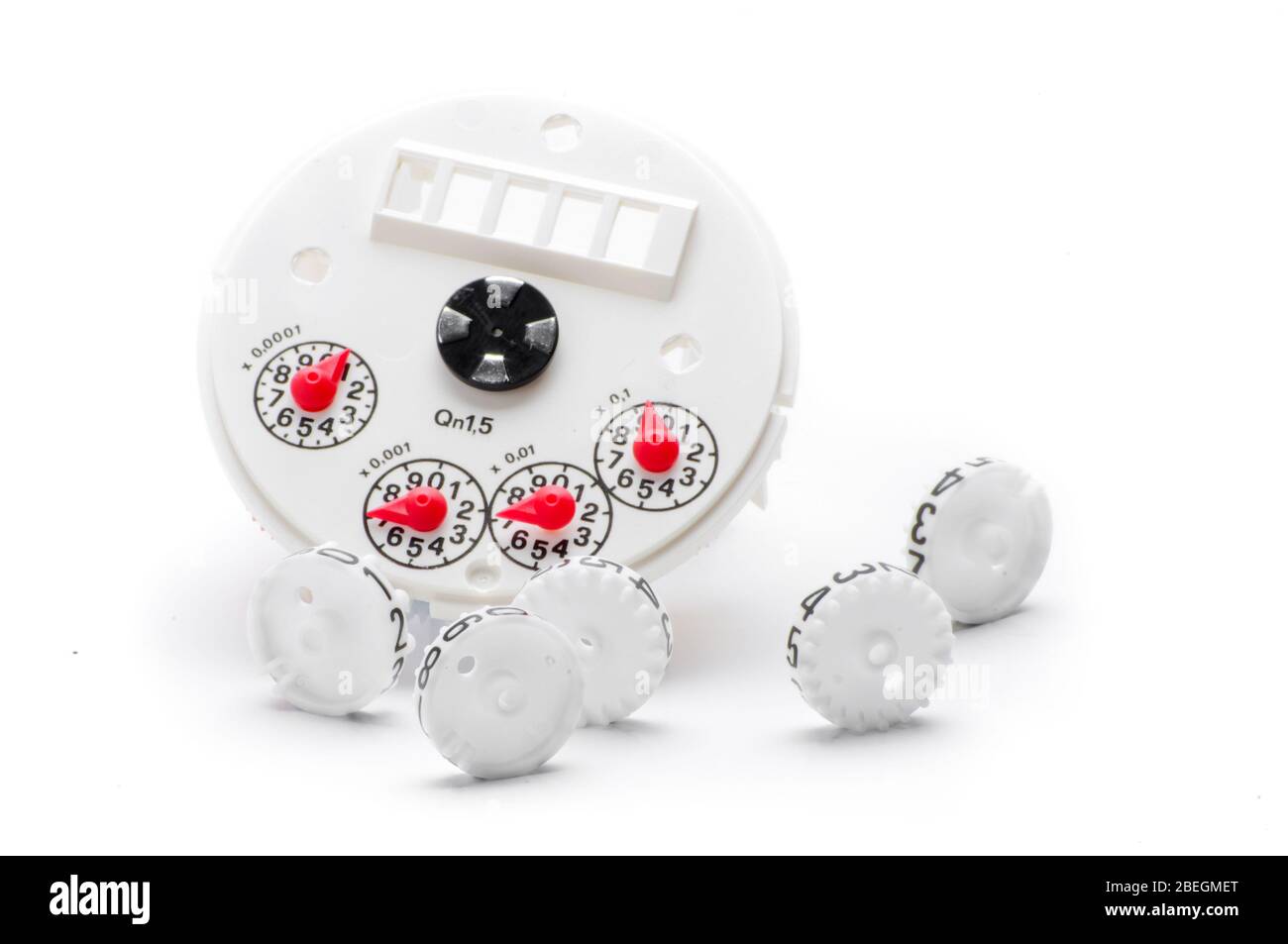 Internal mechanical parts from broken water meter isolated on the white ...