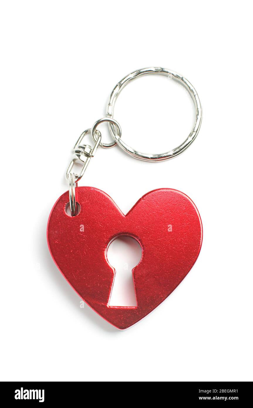 Red heart shape key chain with key hole isolated on the white ...