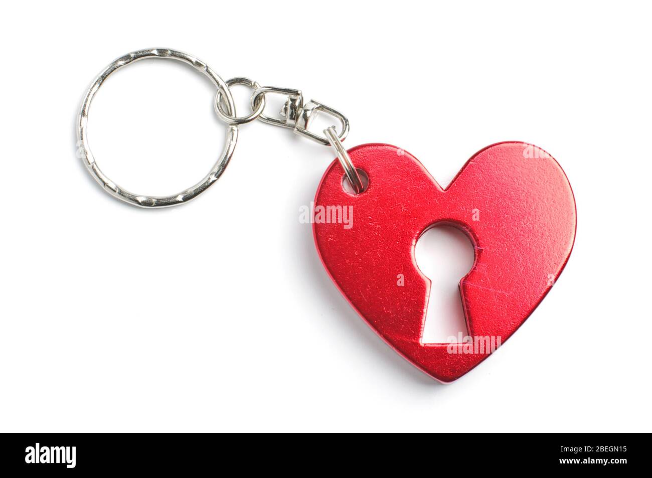 Red heart shape key chain with key hole isolated on the white ...