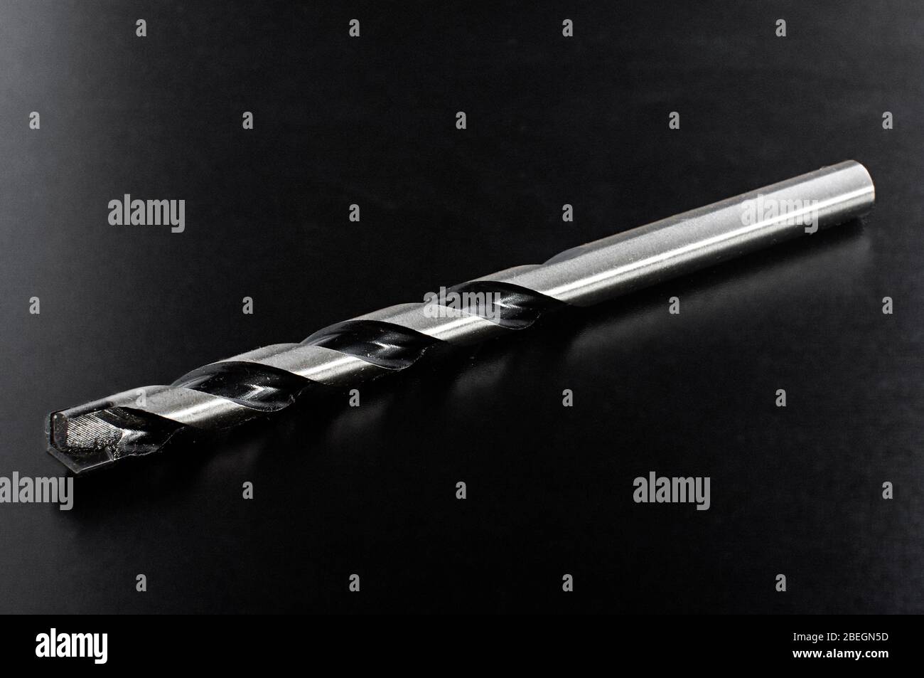 Drill bit close up isolated on the black background Stock Photo - Alamy