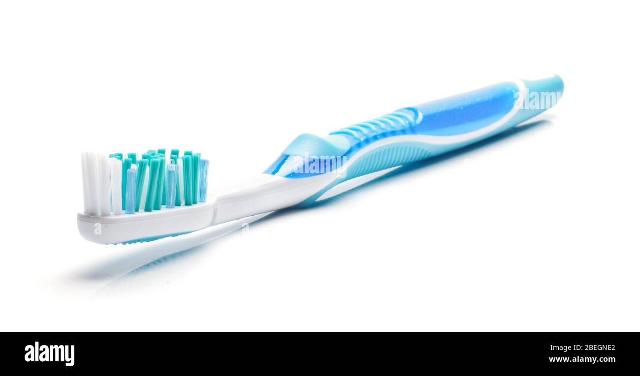 Blue toothbrush isolated on the white. Tooth care equipment Stock Photo ...