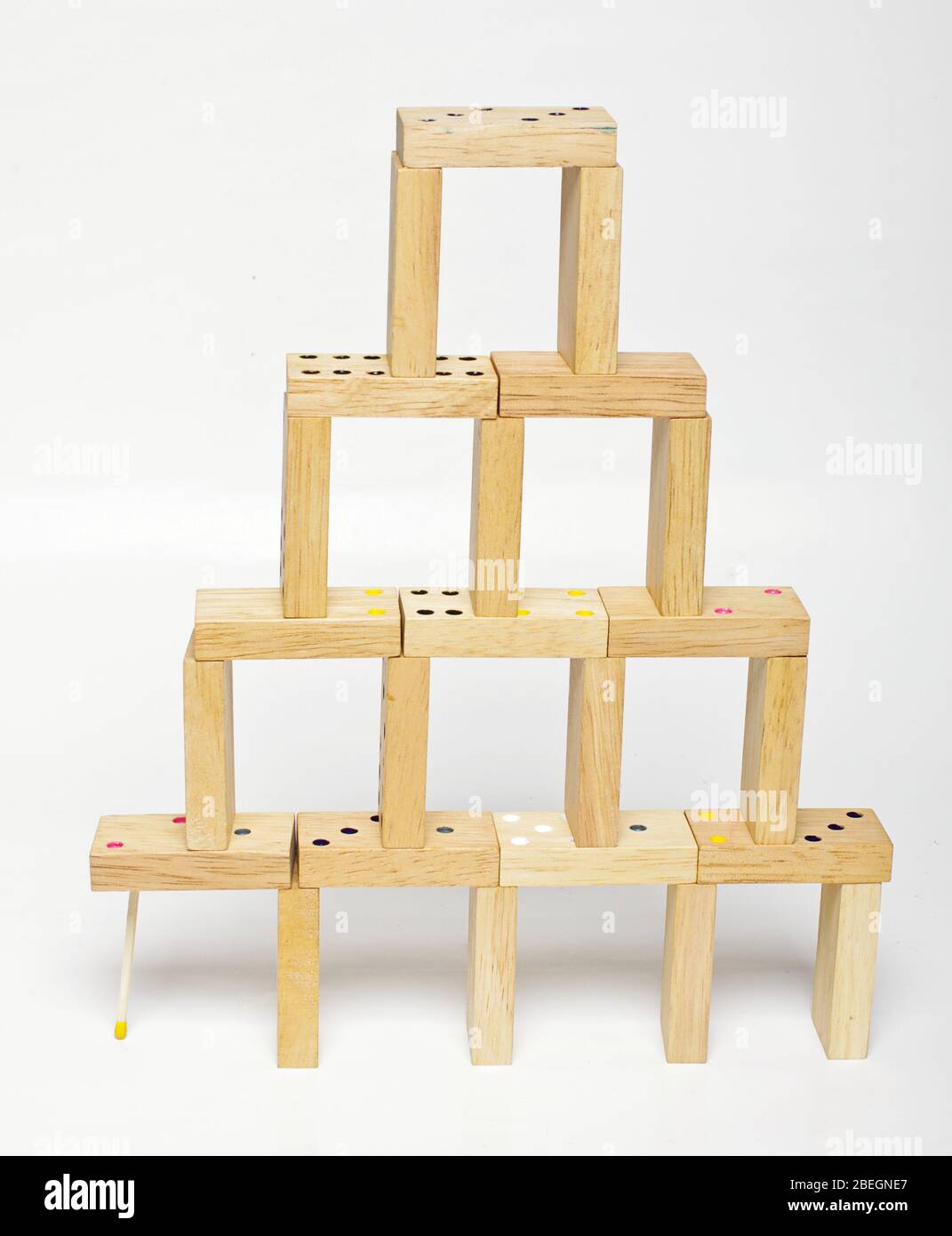 Dominoes and match building isolated on the white background. Weak ...
