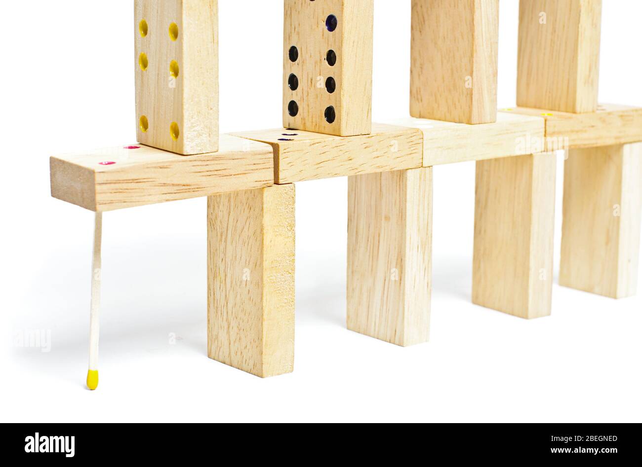 Dominoes and match building isolated on the white background. Weak ...
