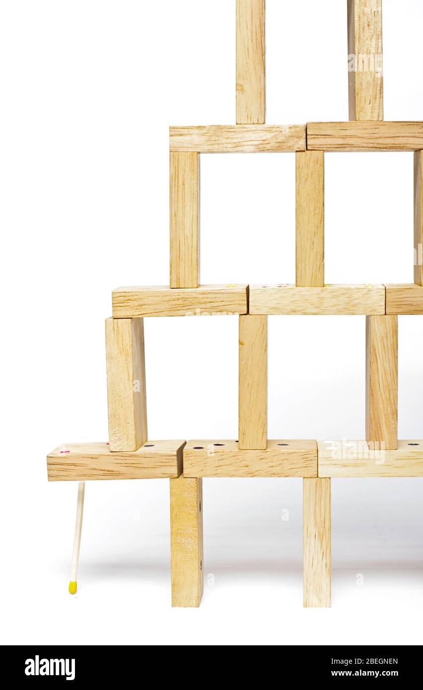 Dominoes and match building isolated on the white background. Weak ...