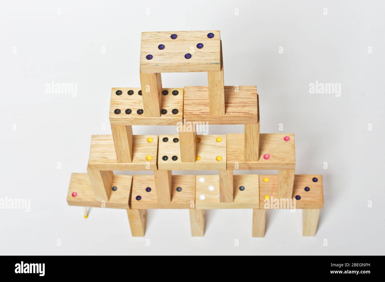 Dominoes and match building isolated on the white background. Weak ...