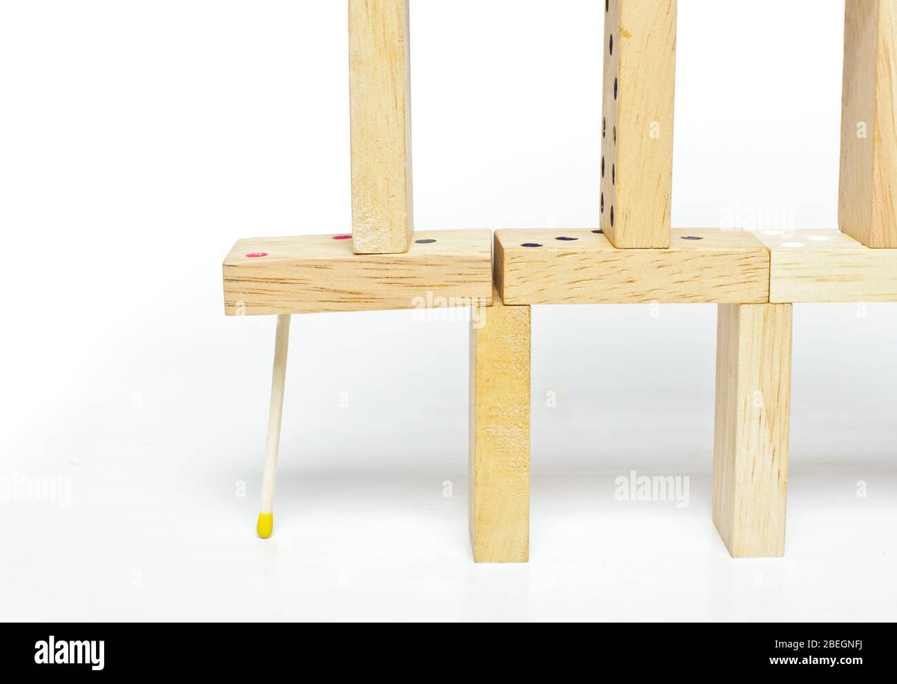 Dominoes and match building isolated on the white background. Weak ...