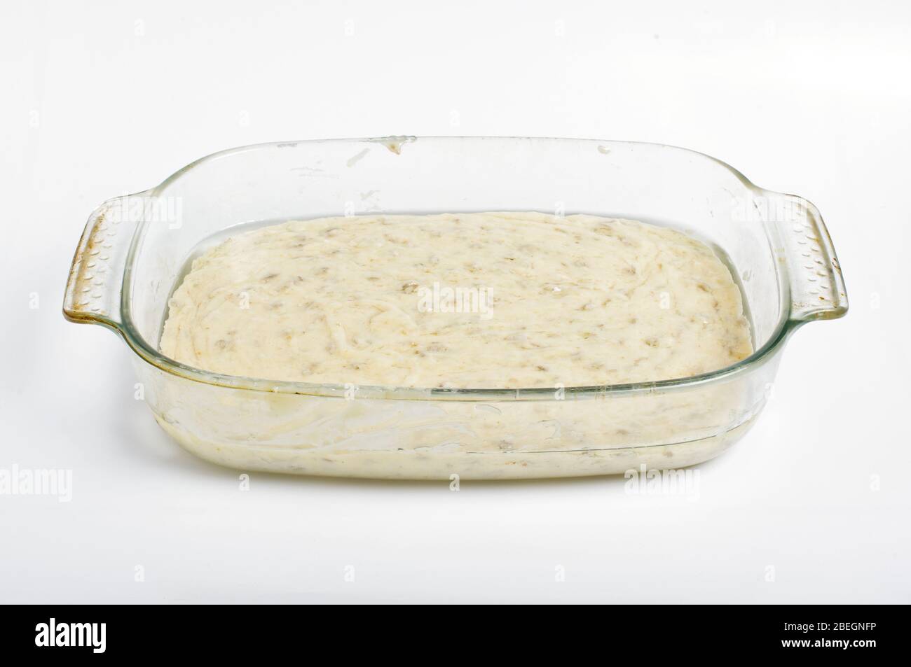 Homemade bread dough in the glass cooking container isolated on the ...
