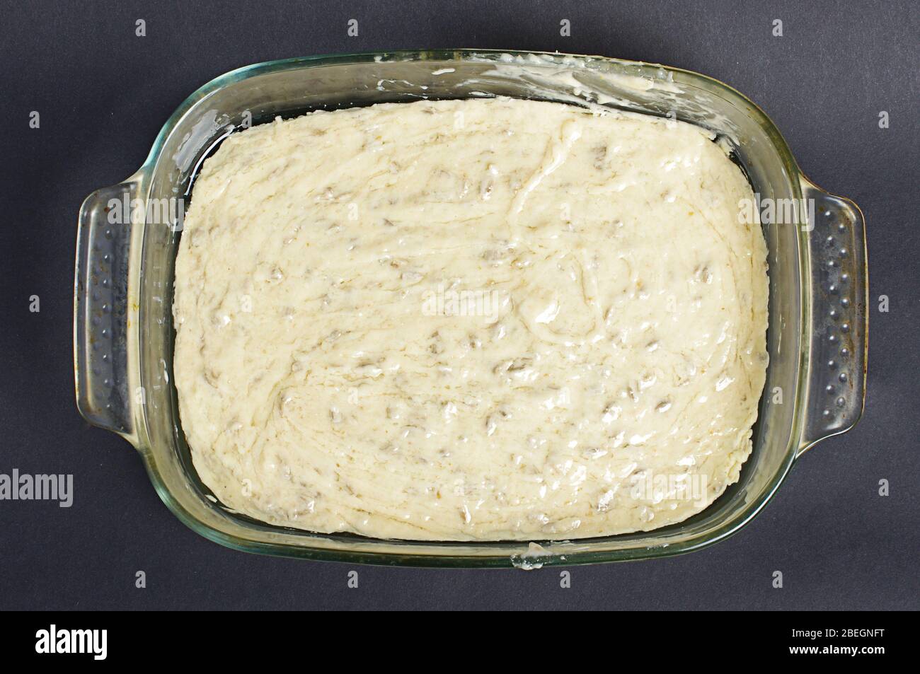 Homemade bread dough in the glass cooking container isolated on the ...