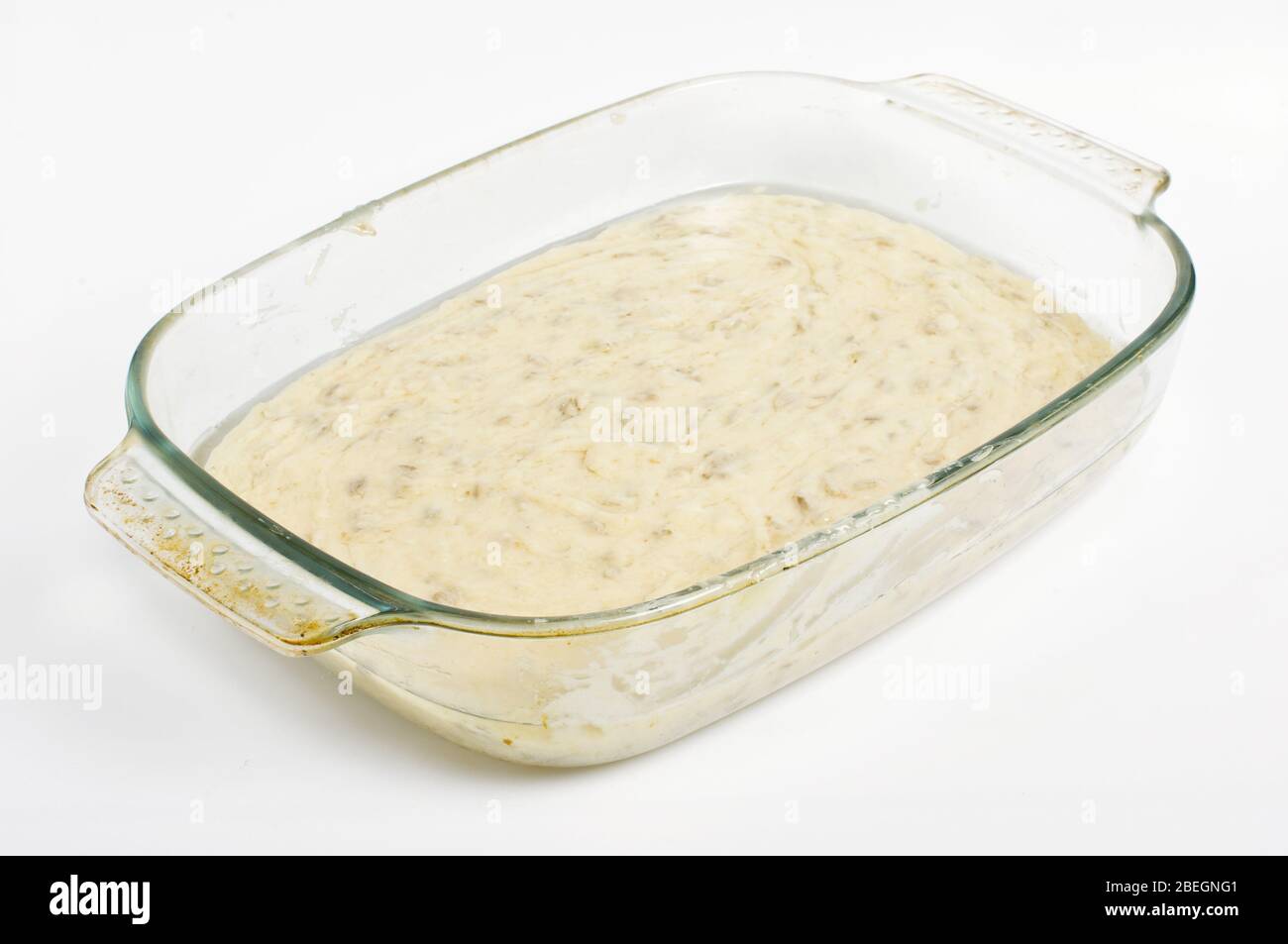Homemade bread dough in the glass cooking container isolated on the ...