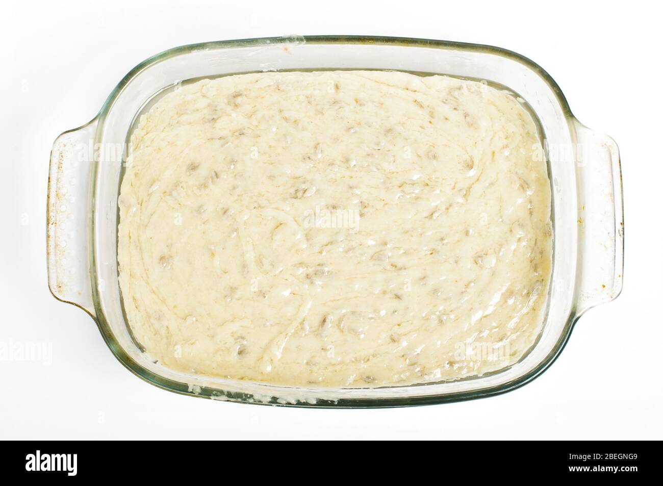 Homemade bread dough in the glass cooking container isolated on the ...