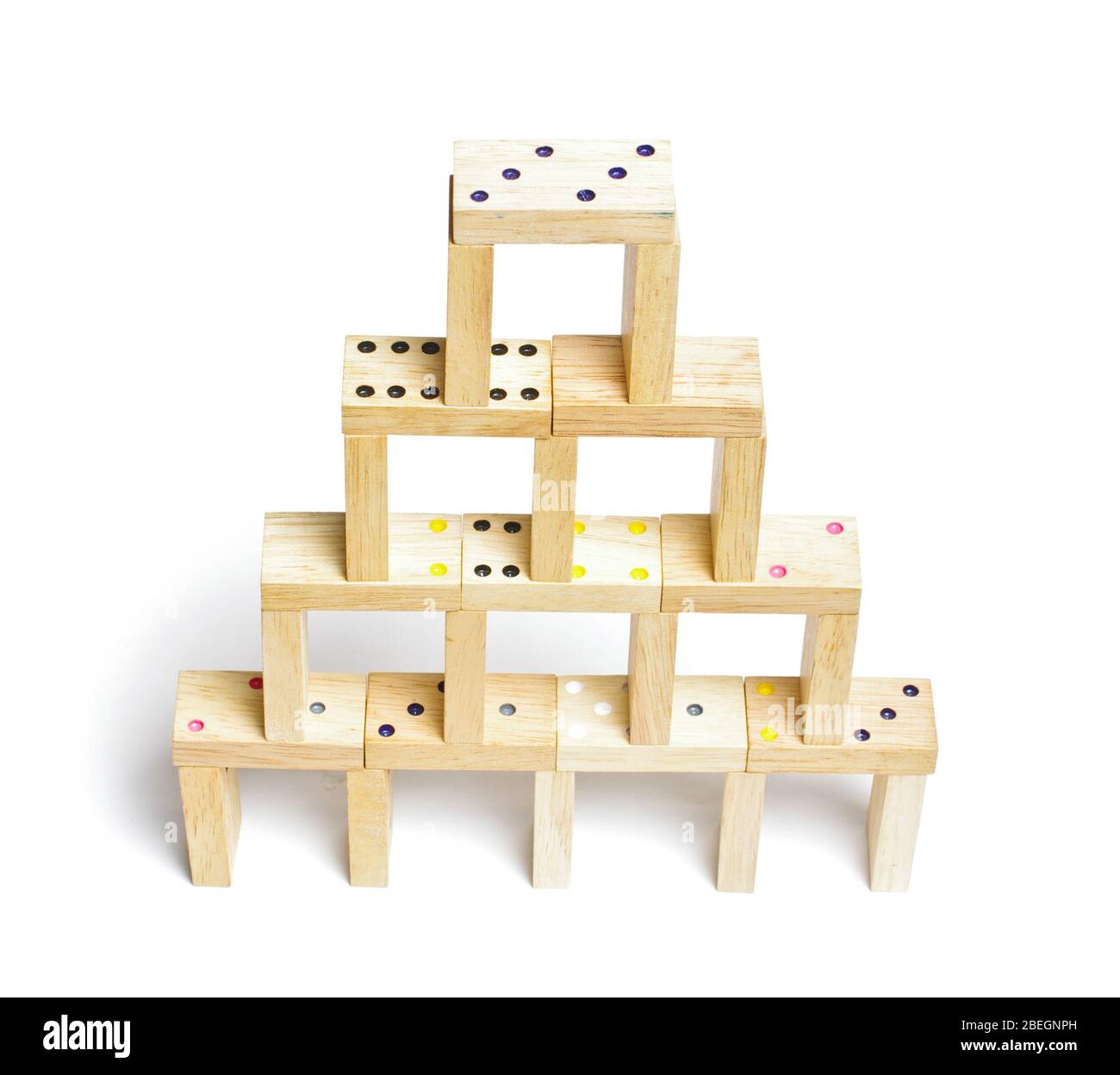 Dominoes pyramid building construction isolated on the white background ...