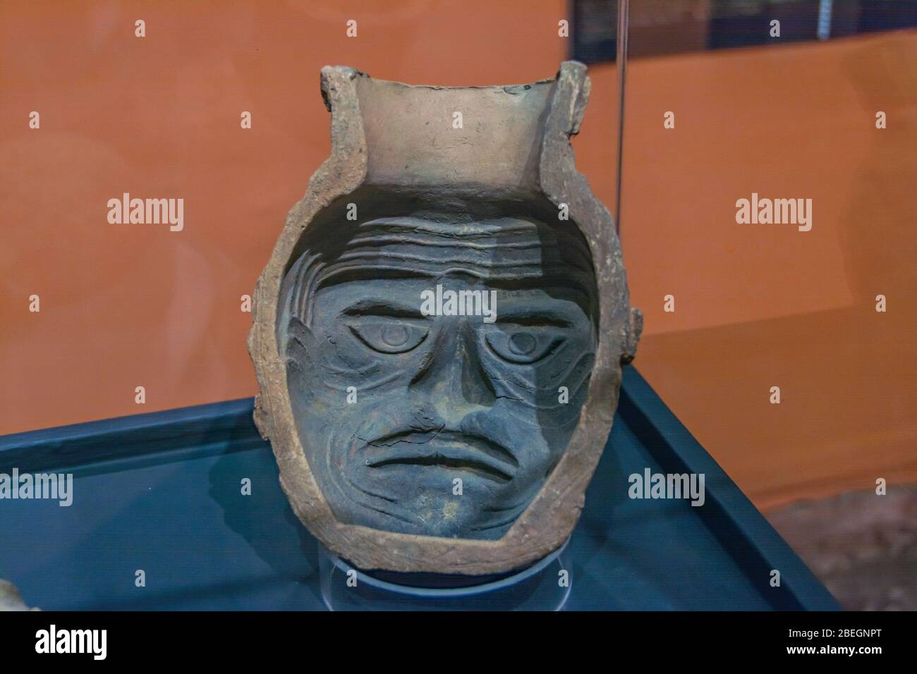 Ancient Mayan face impression in clay Stock Photo - Alamy