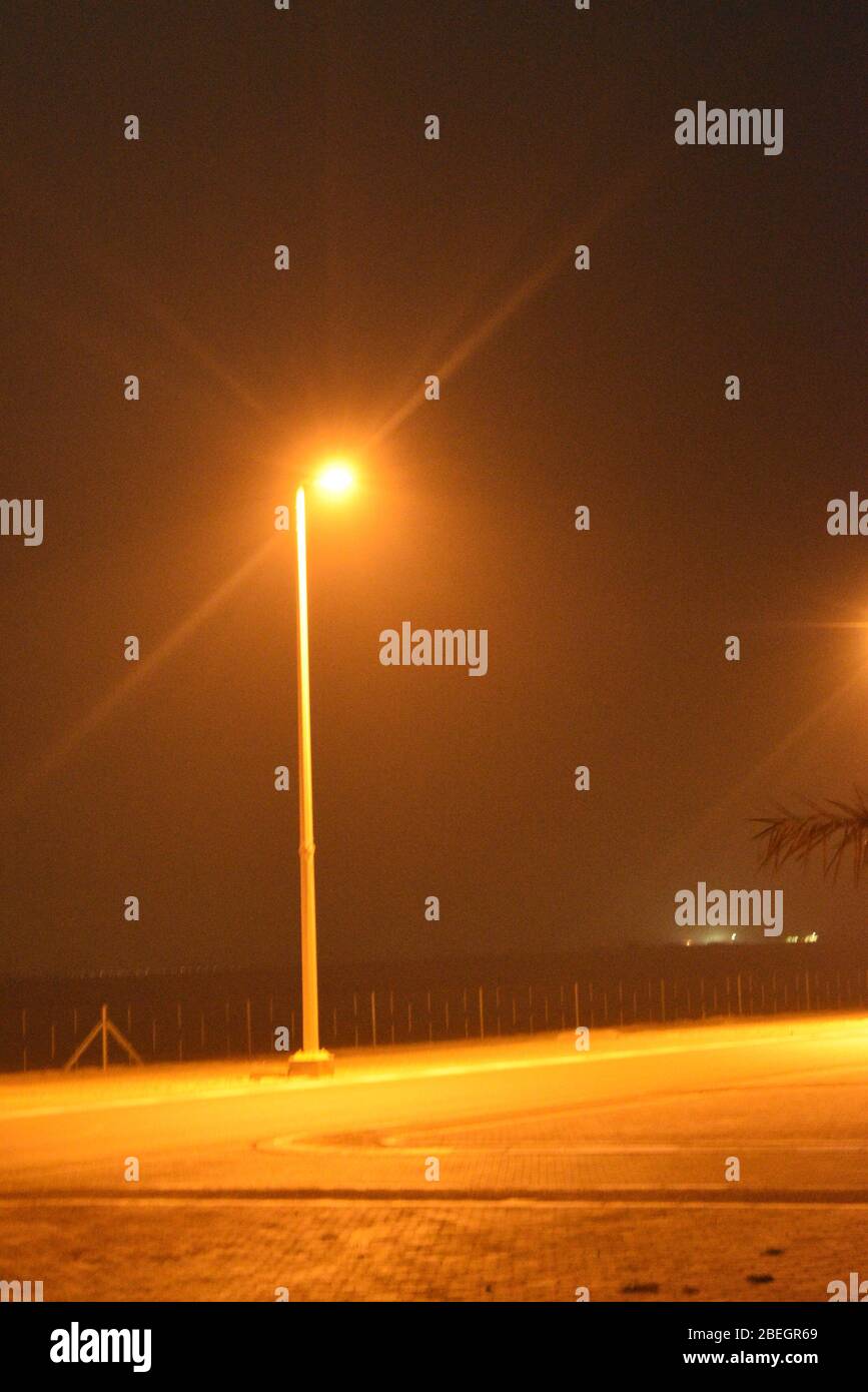 Let light shine out of darkness.View of a street light in night time on ...