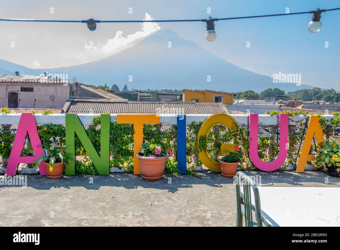 The name of Antigua on colorful sign letters on the roof garden of a ...