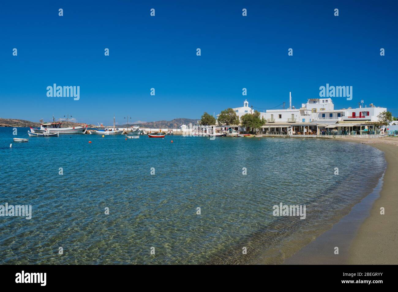 The beach and fishing village of Pollonia in Milos, Greece Stock Photo ...