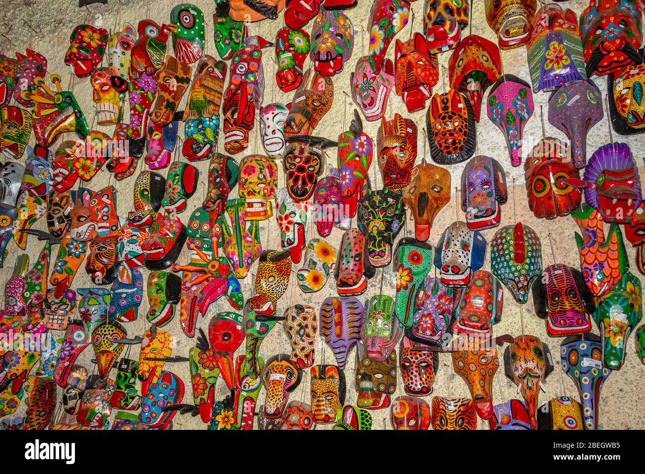 Wall displaying masks for sale at a market in Antigua, Guatemala Stock ...