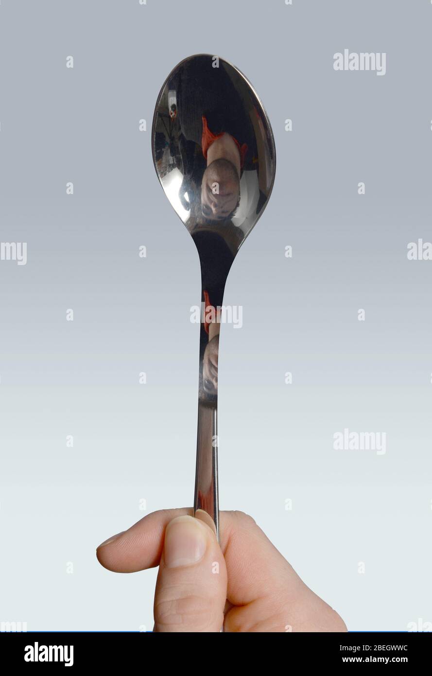 Inverted reflection spoon hi-res stock photography and images - Alamy