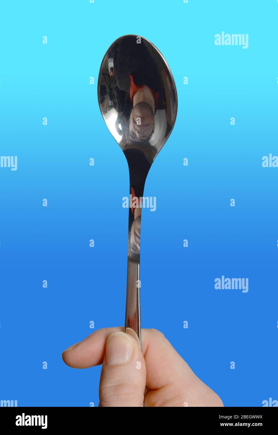 Inverted reflection spoon hi-res stock photography and images - Alamy