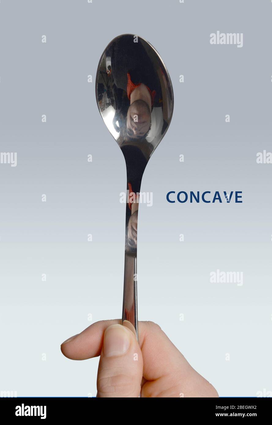 Inverted reflection spoon hi-res stock photography and images - Alamy
