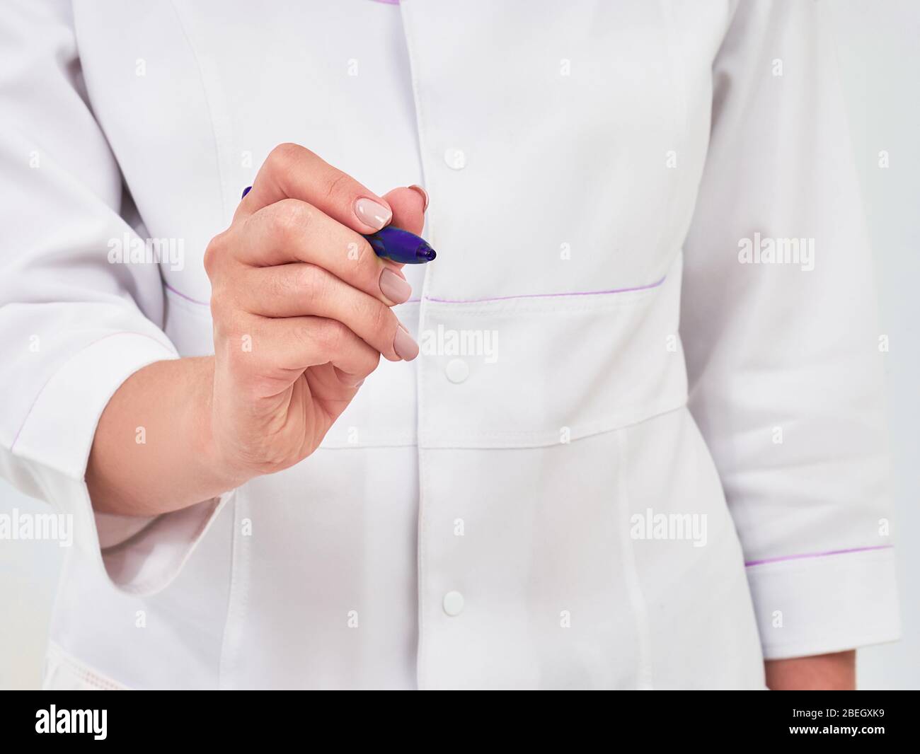 Doctor writing with marker. Doctor making notes. Medical personal with ...