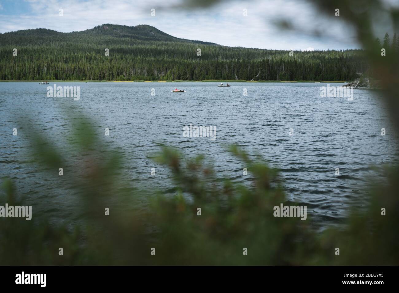 Wide angle view of small boats on scenic lake Stock Photo - Alamy