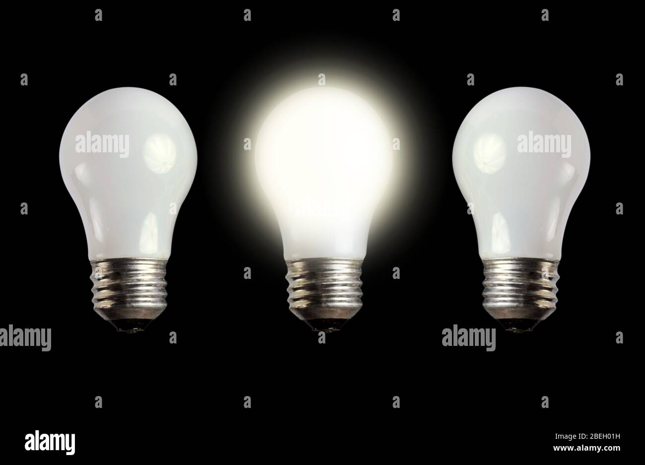 One Lit Light Bulb Stock Photo - Alamy