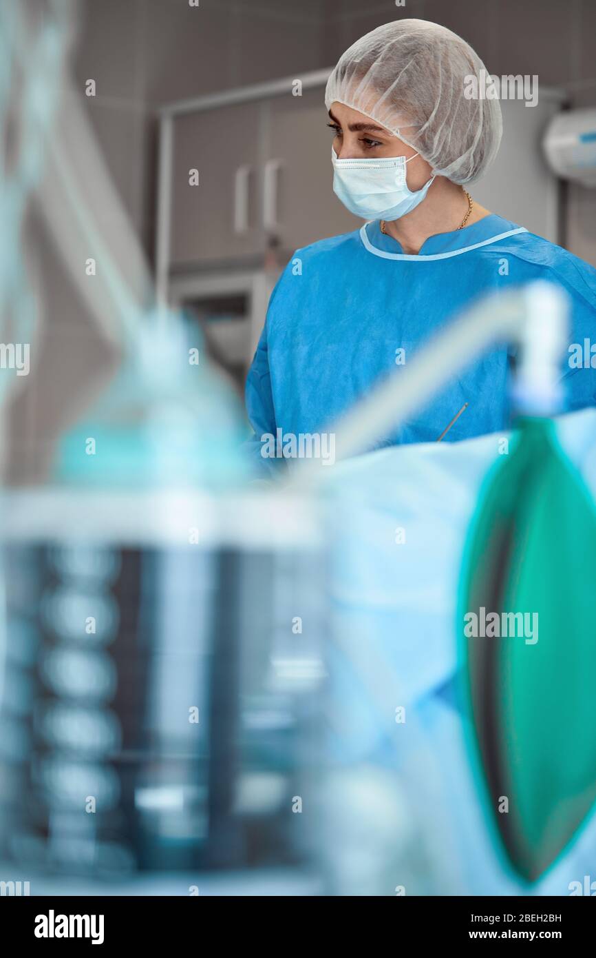 Photograph of doctors in protective masks on the background of a ...