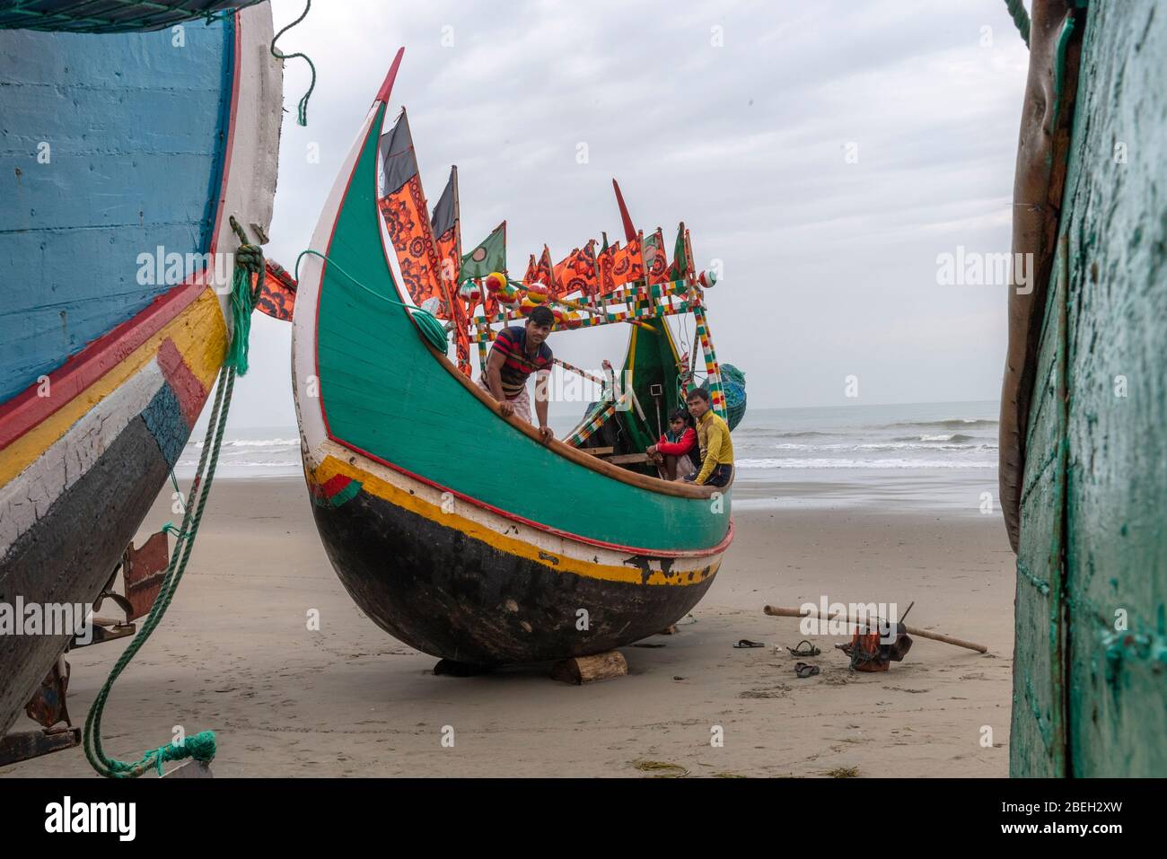 Men On a Moon Shaped Fishing Boat in a Fishing Village South of Cox's ...