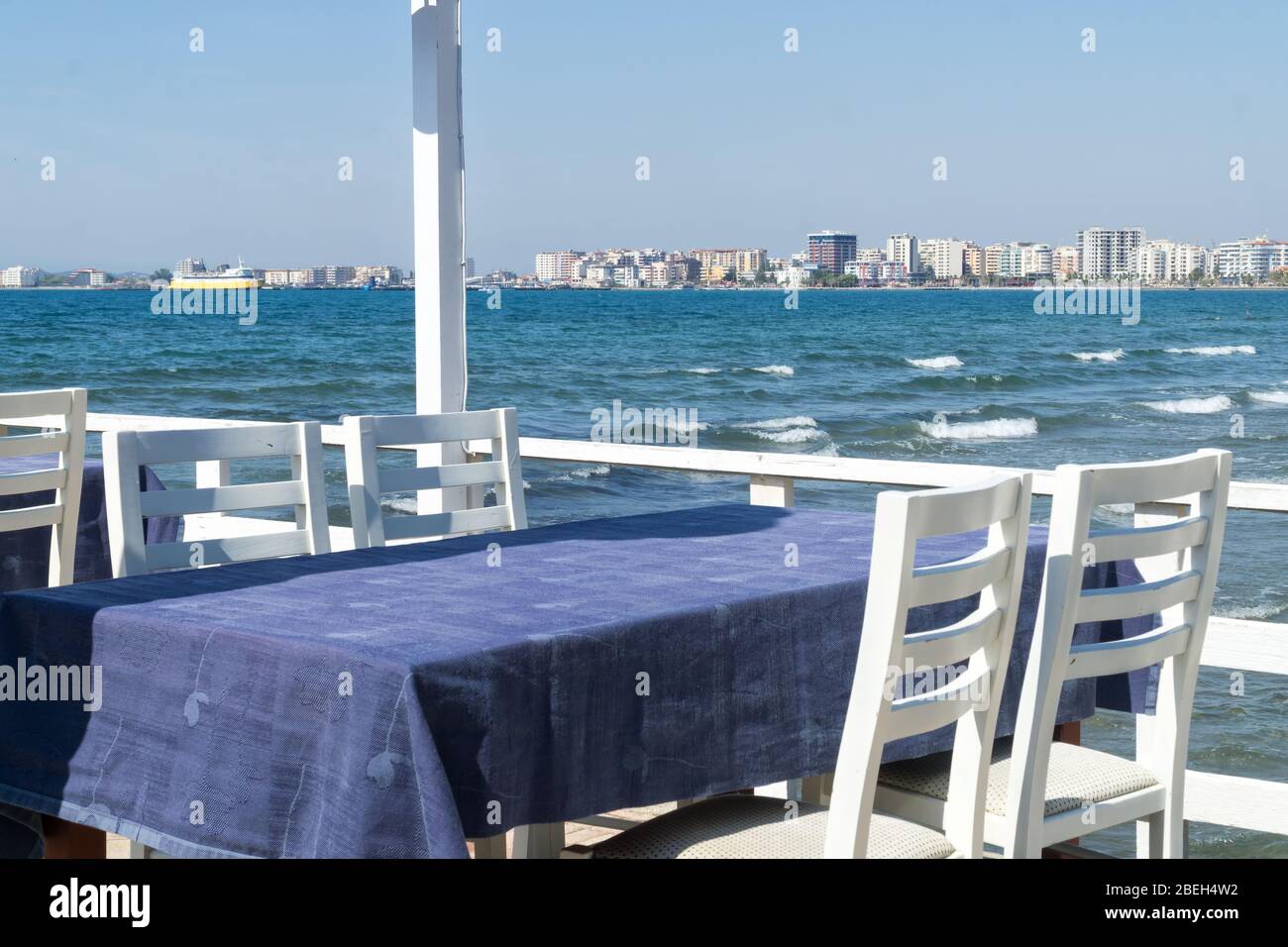 Restaurant on the pier in Vlore, Albania on the Ionian Sea on a sunny ...