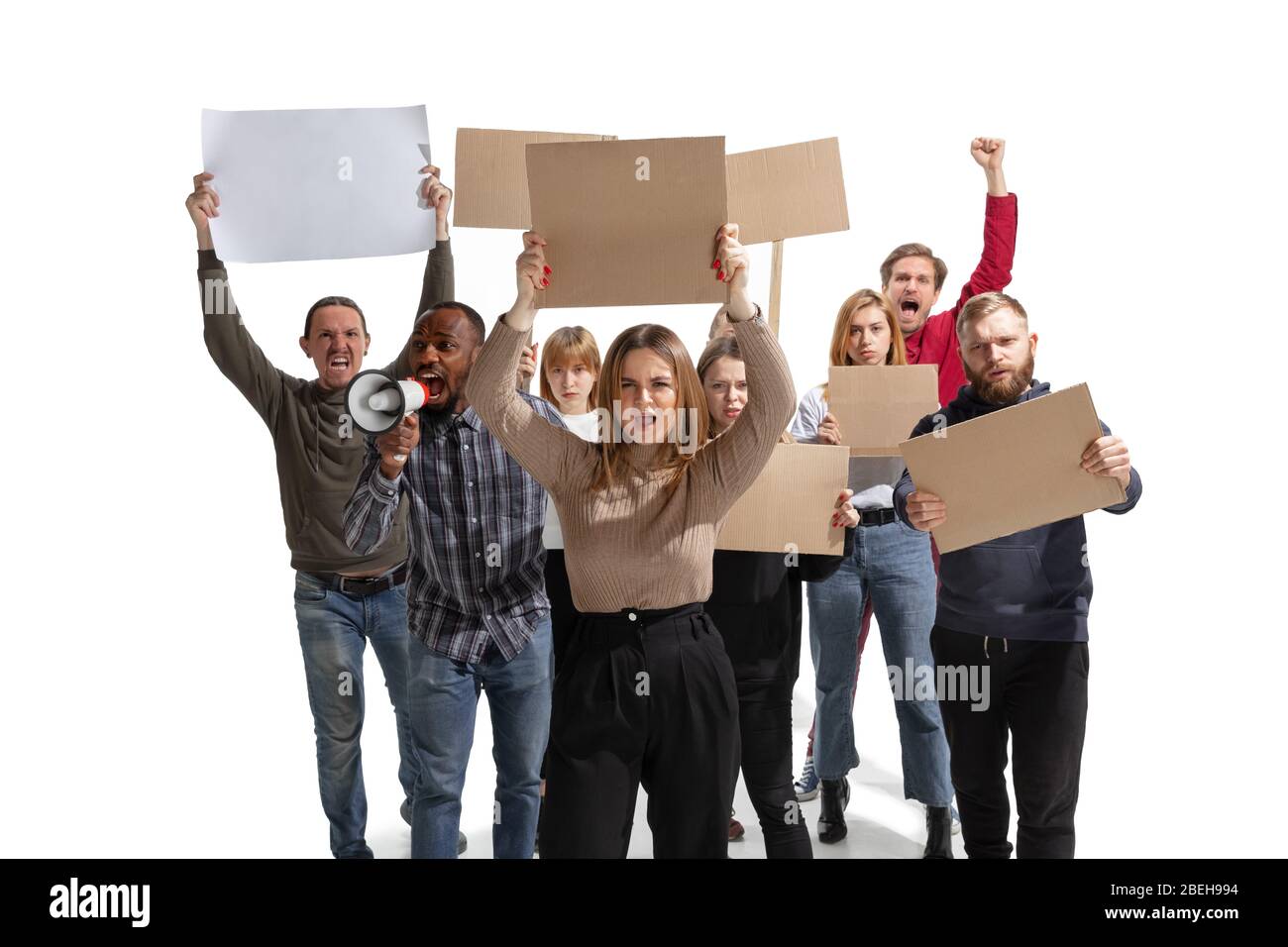 Emotional multicultural group of people screaming while holding blank ...