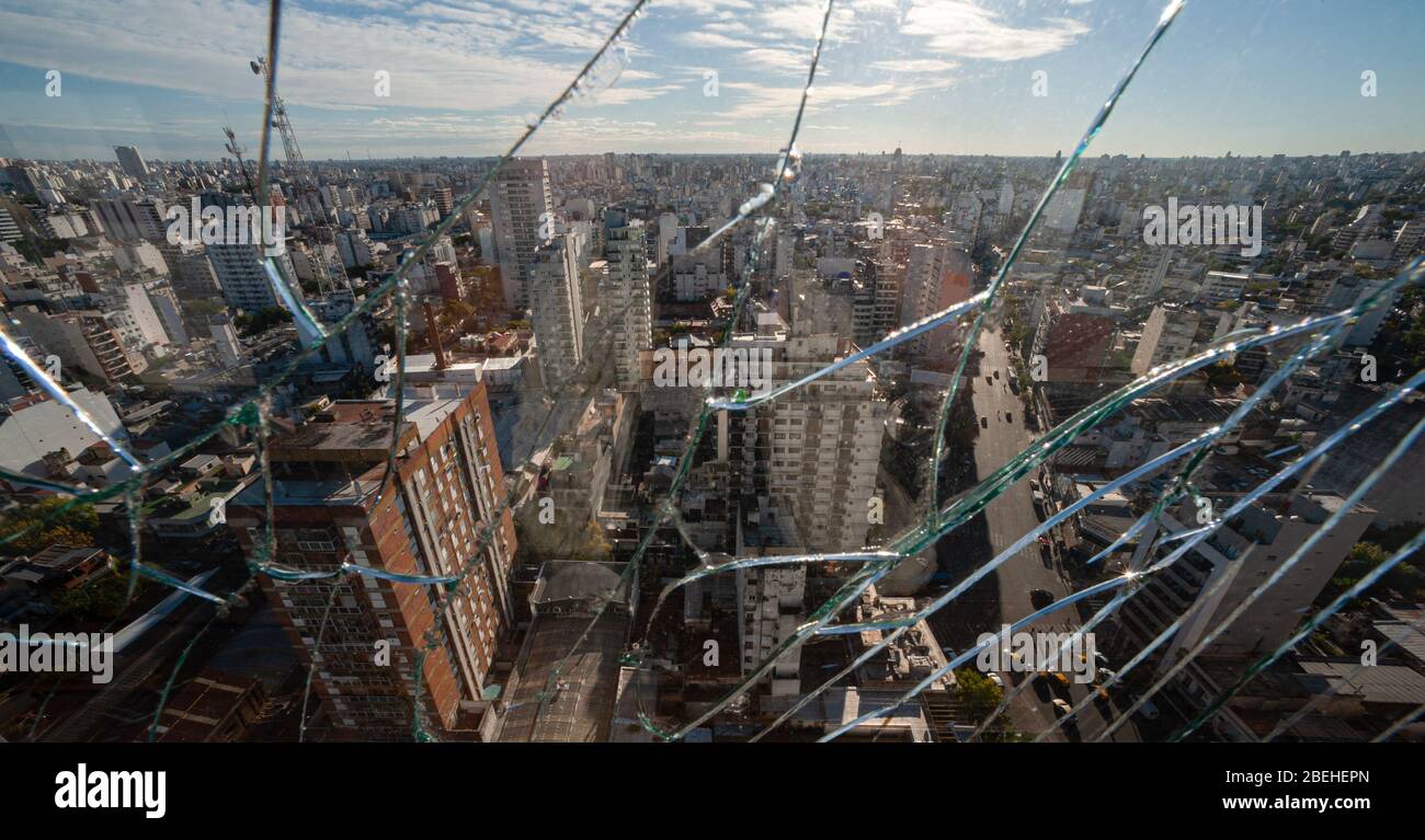 The city shows broken trhough a broken window. Buenos Aires city Stock ...