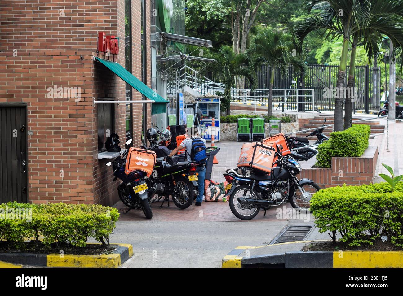 Home delivery workers preparing their orders outside a supermarket in ...