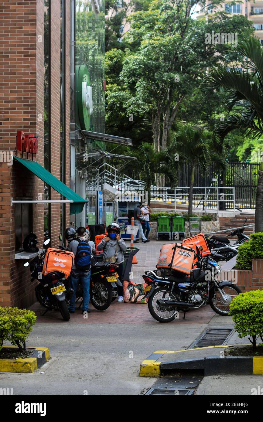 Home delivery workers preparing their orders outside a supermarket in ...