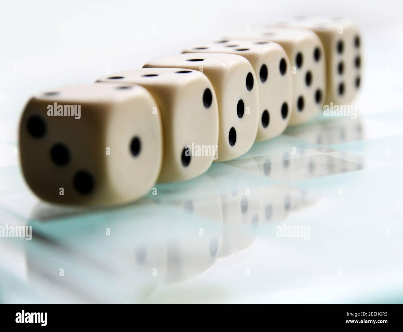 A row of six dice - showing the sequential numbers 1 - 6, sitting on a ...