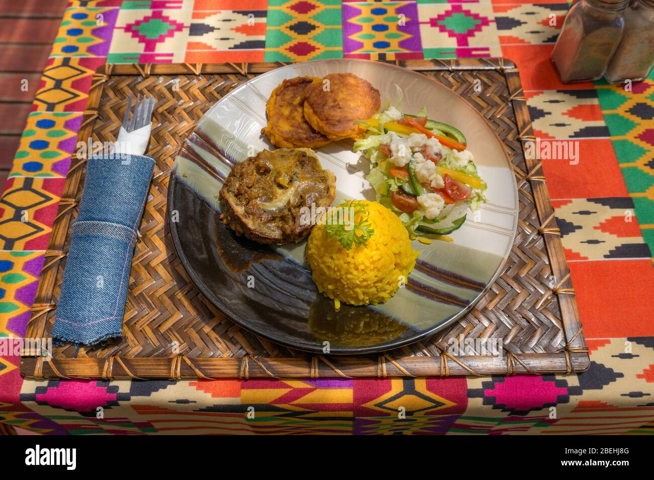 Traditional African cuisine bobotie mince with rice and salad. Ethnic ...